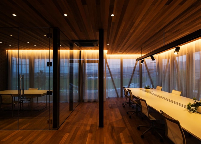Glass + Wood building in Japan wraps around natural foliage - Homecrux
