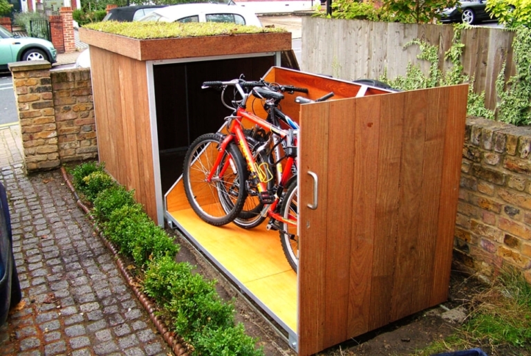Contemporary outdoor bike locker doubles as clever green planter - Homecrux