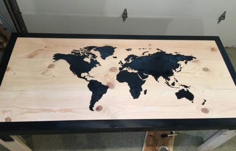 Imgur user builds world map dining table using wood burning tool
