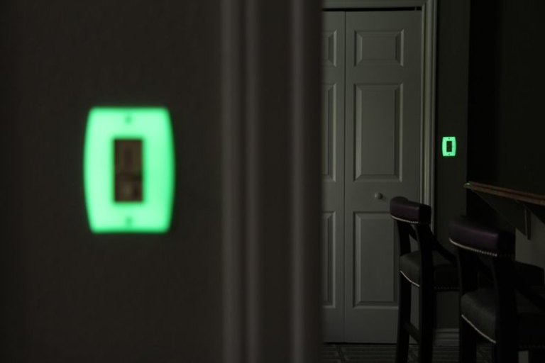 Light switch plates with glow in dark feature