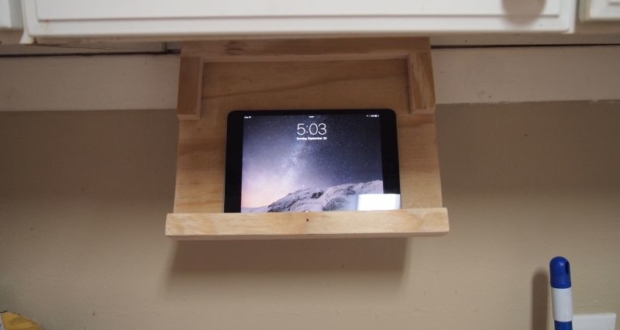 DIY iPad holder under kitchen cabinet keeps online recipes closeby