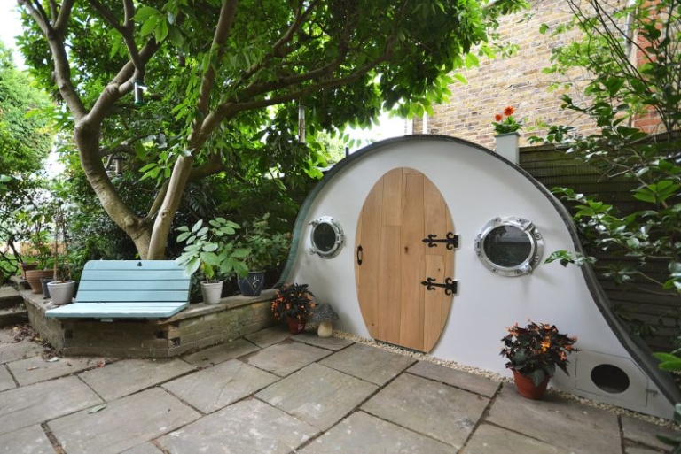 Hobbit house garden shed appears to be crafted by mythical critters