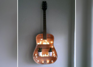 14 Ways to Use an Old Guitar to Spice up Your Home Décor