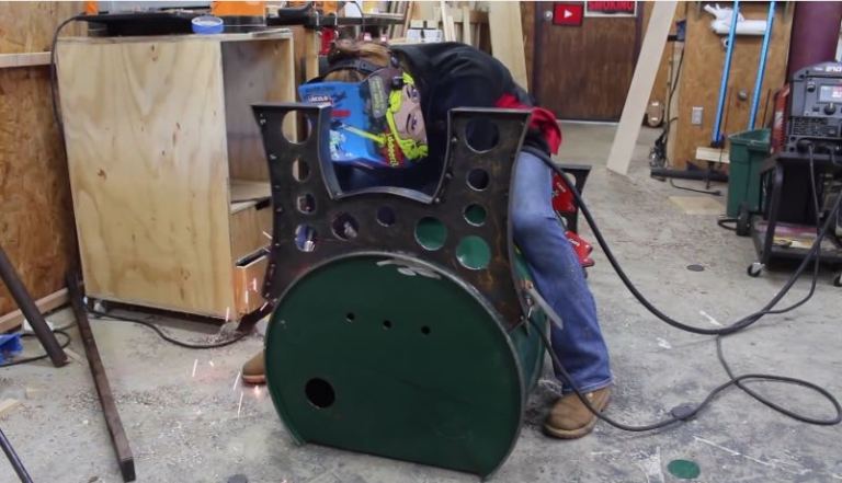 DIYer upcycles Old Drum into Functional Scrap Wood-Burning Pit