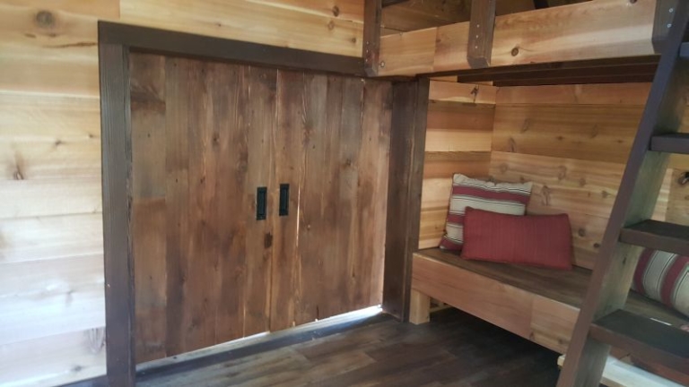 This DIY built mini treehouse in Western US features a slide for kids