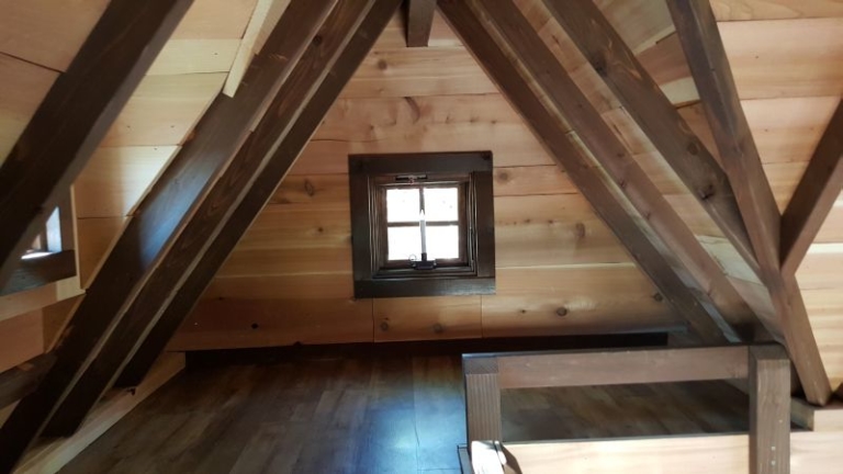 This DIY built mini treehouse in Western US features a slide for kids