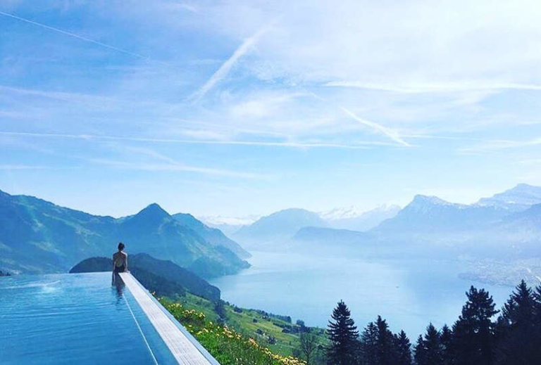Heated infinity pool at Hotel Villa Honegg offers sweeping views of ...