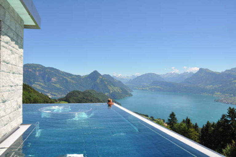 Heated infinity pool at Hotel Villa Honegg offers sweeping views of ...