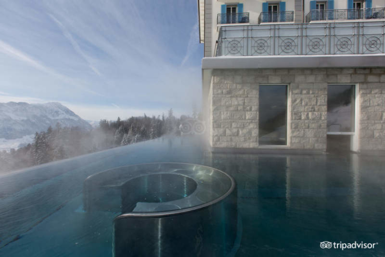Heated infinity pool at Hotel Villa Honegg offers sweeping views of ...