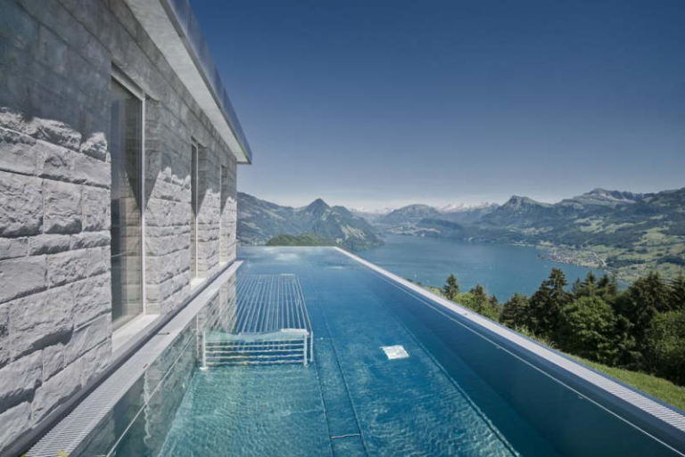 Heated infinity pool at Hotel Villa Honegg offers sweeping views of ...