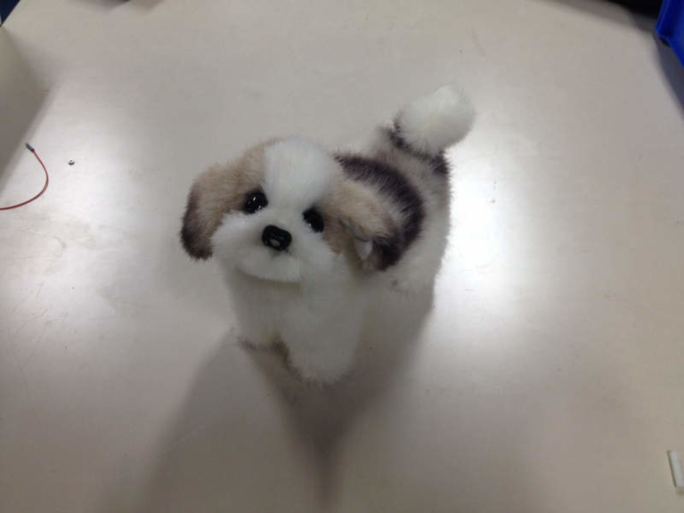 This fluffy Japanese robot dog faints in response to stinky feet