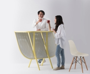 Multifunctional room divider that transforms into a bar table