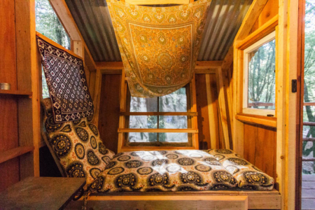 This Boho Style Cabin Comes with its Own Treehouse and Zip Line