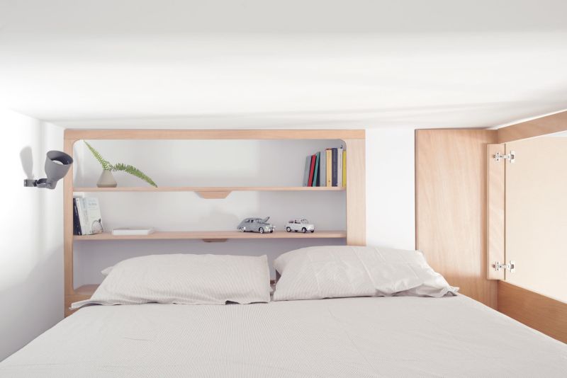 Custom Wall Unit with Built-in Furniture Makes This Apartment Look Spacious