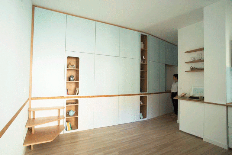 Custom Wall Unit with Built-in Furniture Makes This Apartment Look Spacious