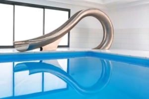 Waha Residential Water Slide from SplinterWorks Fits into Existing Pools