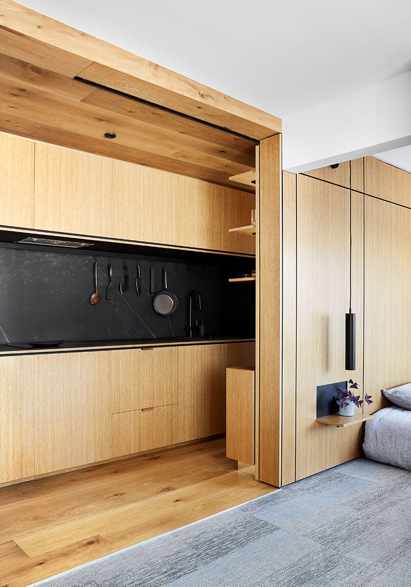 This 35-Square-Meter Apartment Hides Bedroom Behind Sliding Walls