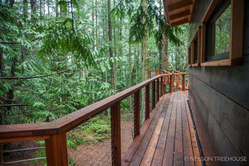 This Treehouse in San Juan Islands Features Fire Pole from Deck