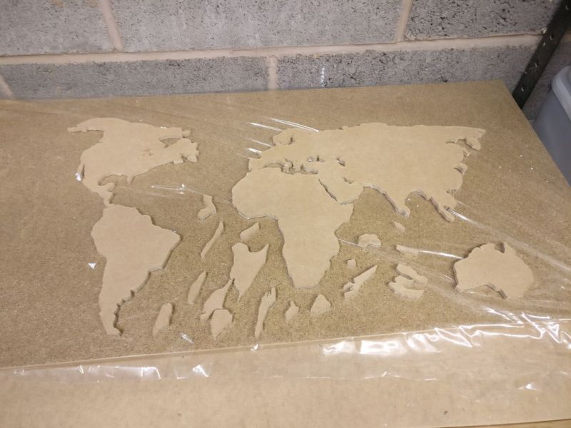 DIY-er Builds Coffee Table with Backlit World Map Beneath a Glass Top