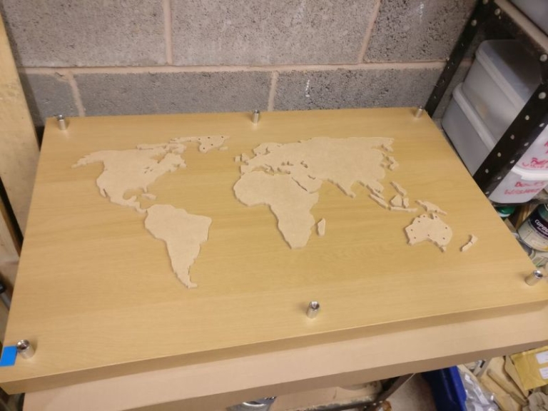 DIY-er Builds Coffee Table with Backlit World Map Beneath a Glass Top