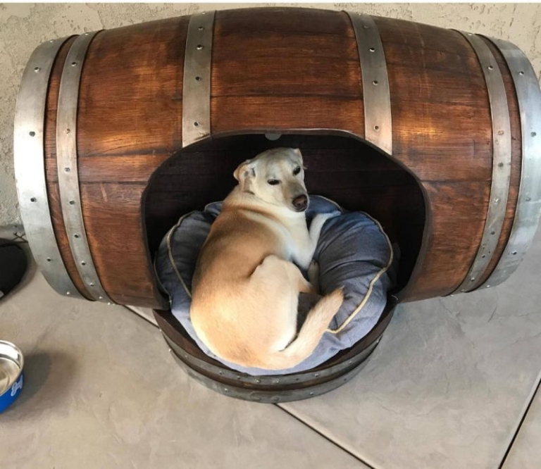 Repurposed Wine Barrel Dog House with Paw Windows