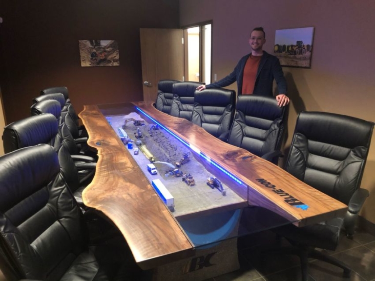 Live-Edge Boardroom Table Hides an Entire Construction Site Within