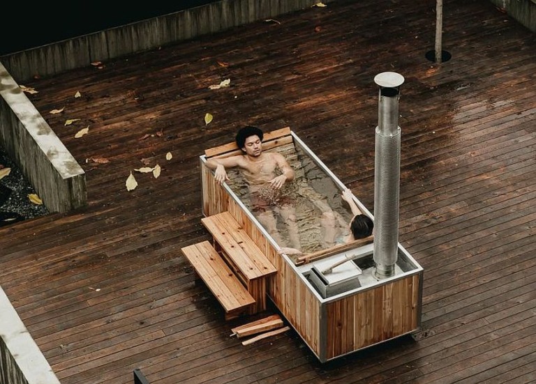 This Recyclable Wood-Burning Hot Tub is Your Recliner For Soothing Soak