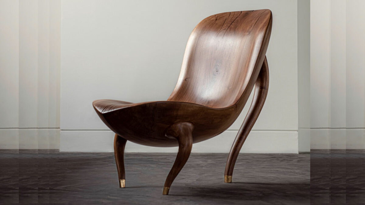 This Curvy Wooden Chair Sits on Two Legs and A Ponytail