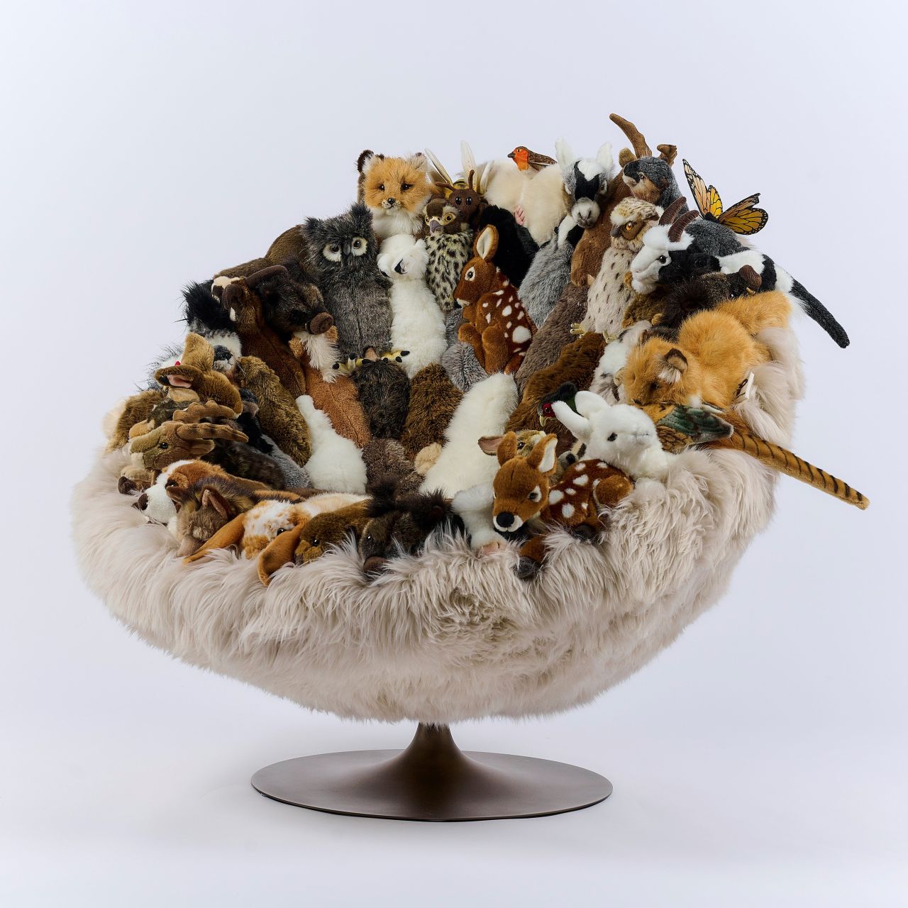 Alpin Armchair is Glammed with Pretty Stuffed Animals