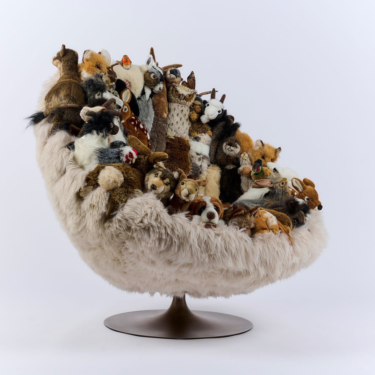 Alpin Armchair is Glammed with Pretty Stuffed Animals