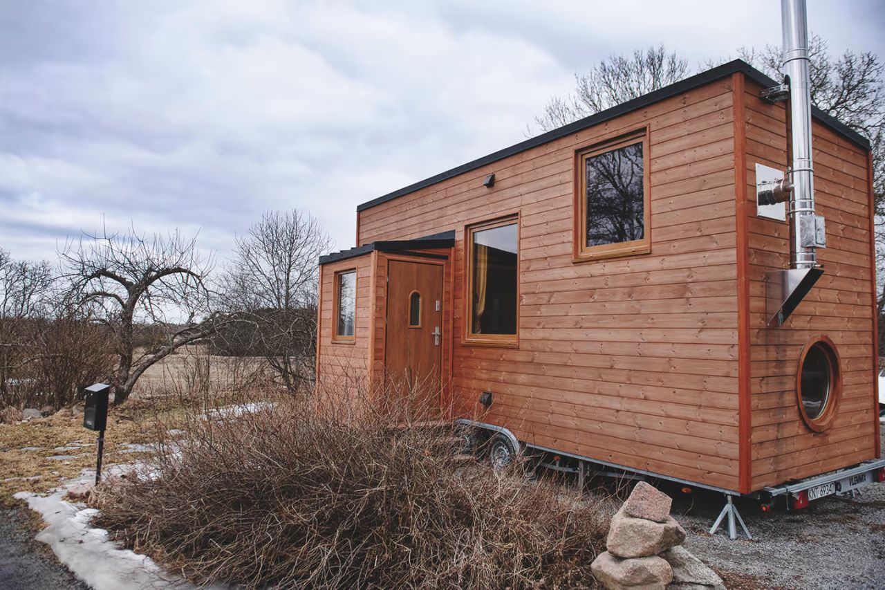 Elise Tiny House on Wheels Features a Raised Living Room