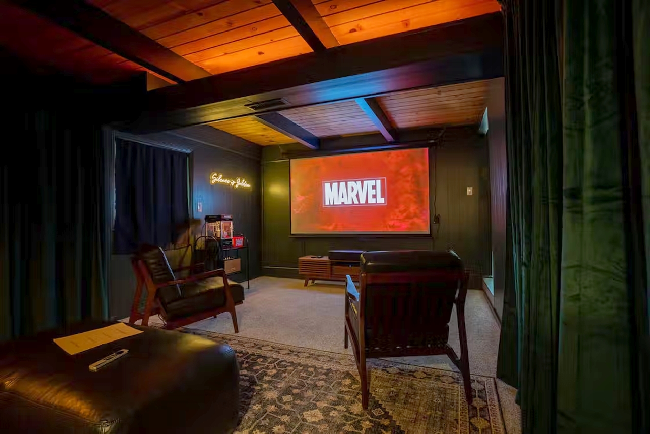 Lightfoot Cabin has Theater Room Hidden Behind Bookcase Door