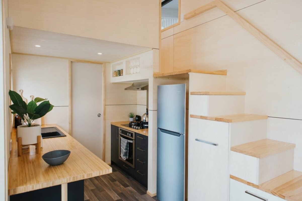 Build Tiny Creates Home Haven with Dual Lofts, Private Staircases