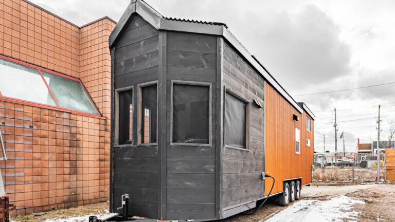 Sherloak Homes Tiny House has Secret Sunroom in 2-Loft Design