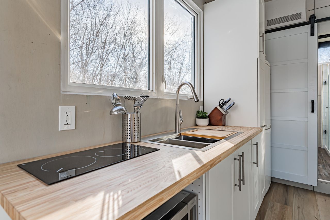 Elevate Tiny House With Ceiling Bed Feels Like Luxurious Condo