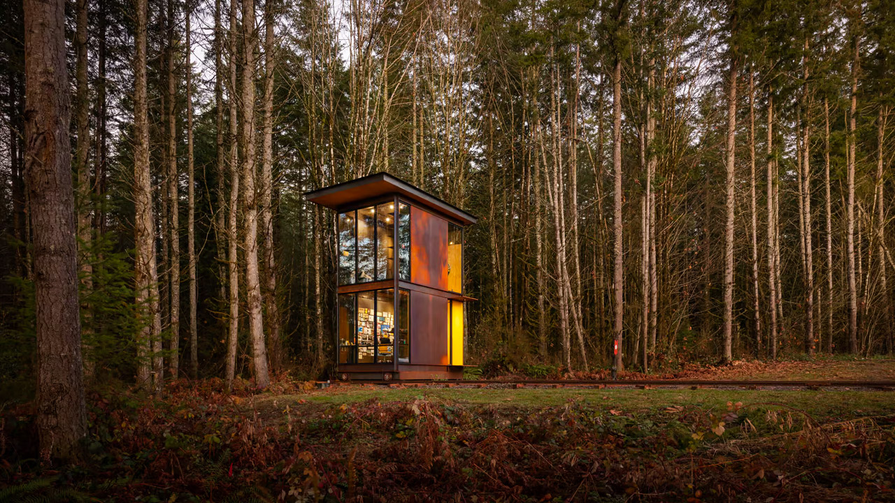 Two-Story Maxon Studio is Mobile Home Office on Railway Track