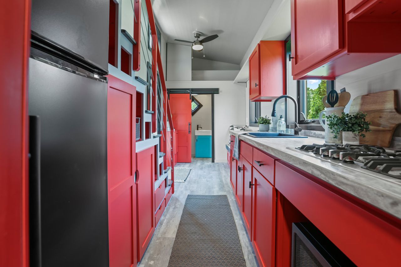 With Red Interior, MTL Rocket Tiny Home is Splashed Blue Outside