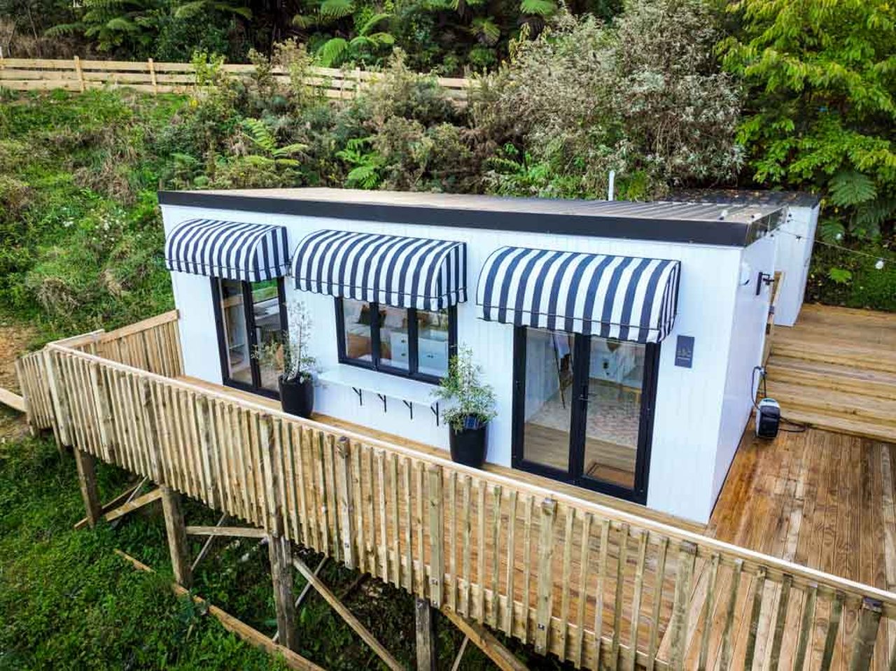 This Tiny Home With Magical Glasshouse Dining Room Allows Pets