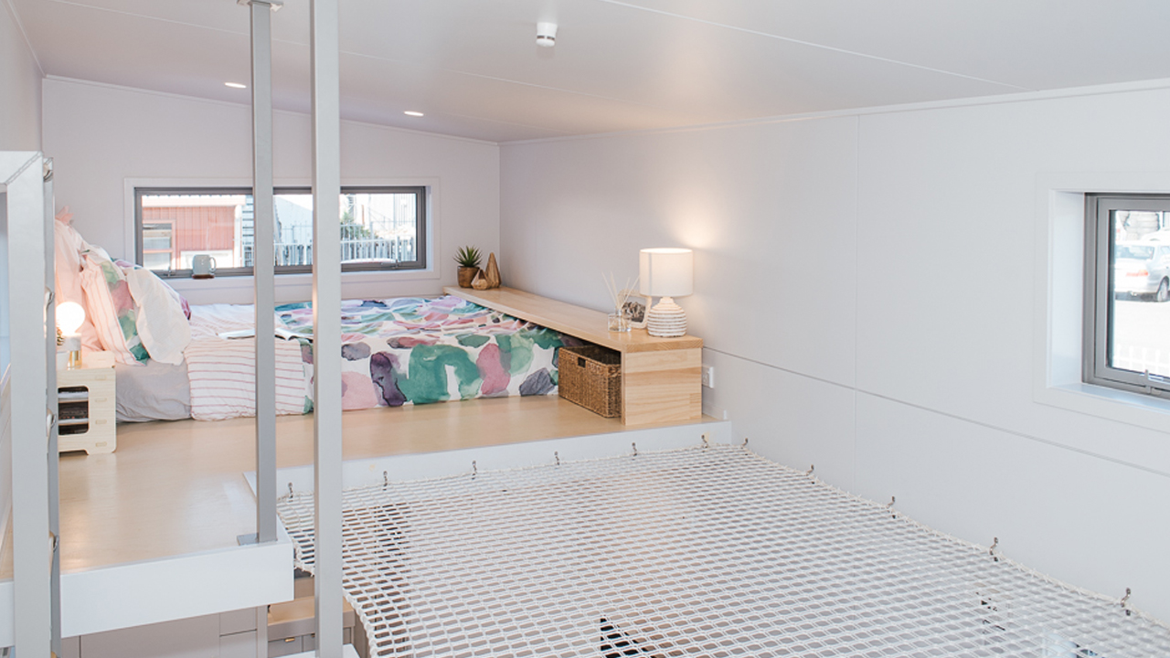 Larissa & Tyler's Tiny House has Dual Lofts With Suspension Net