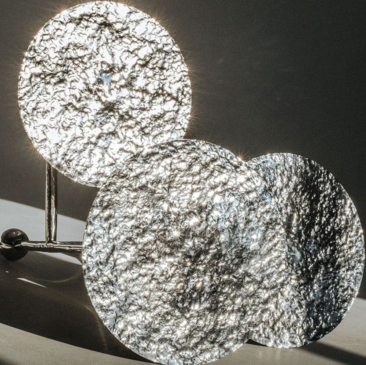 Liquid Table Boasts a Hand-Hammered Metallic Design