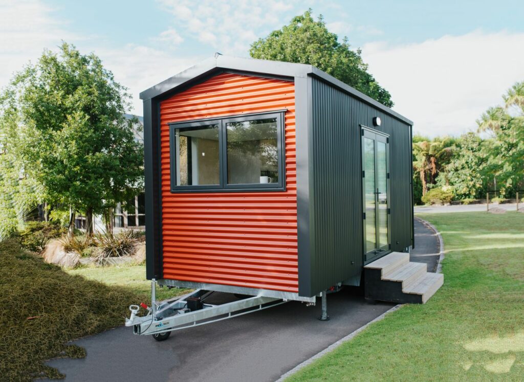 Camper Tiny House Features Drop-Down Ceiling Bed, Sofa Bed