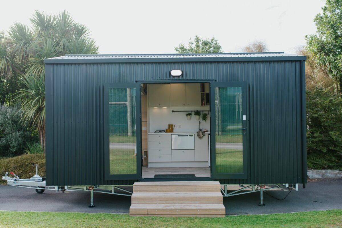 Camper Tiny House Features Drop-Down Ceiling Bed, Sofa Bed
