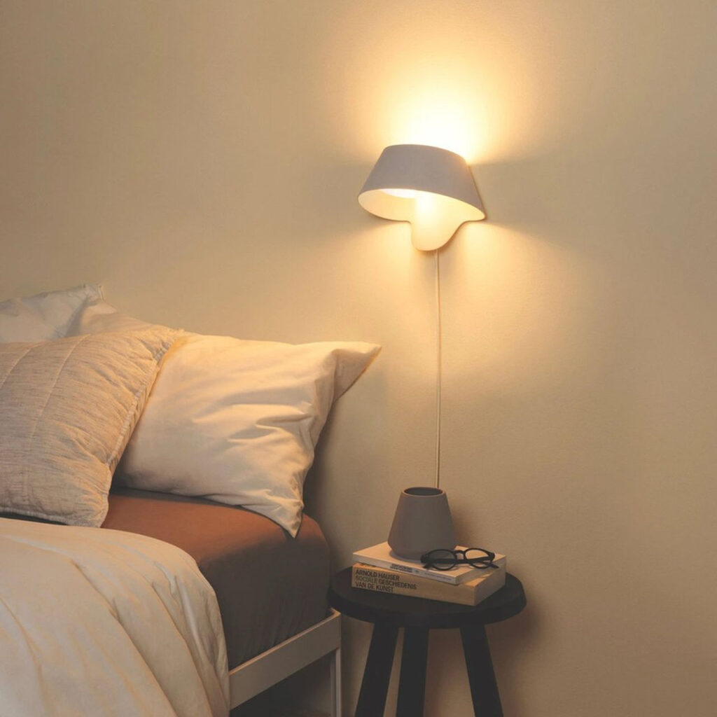 Fold Wall Light Flaunts Curved Design Creating Warmth and Glow