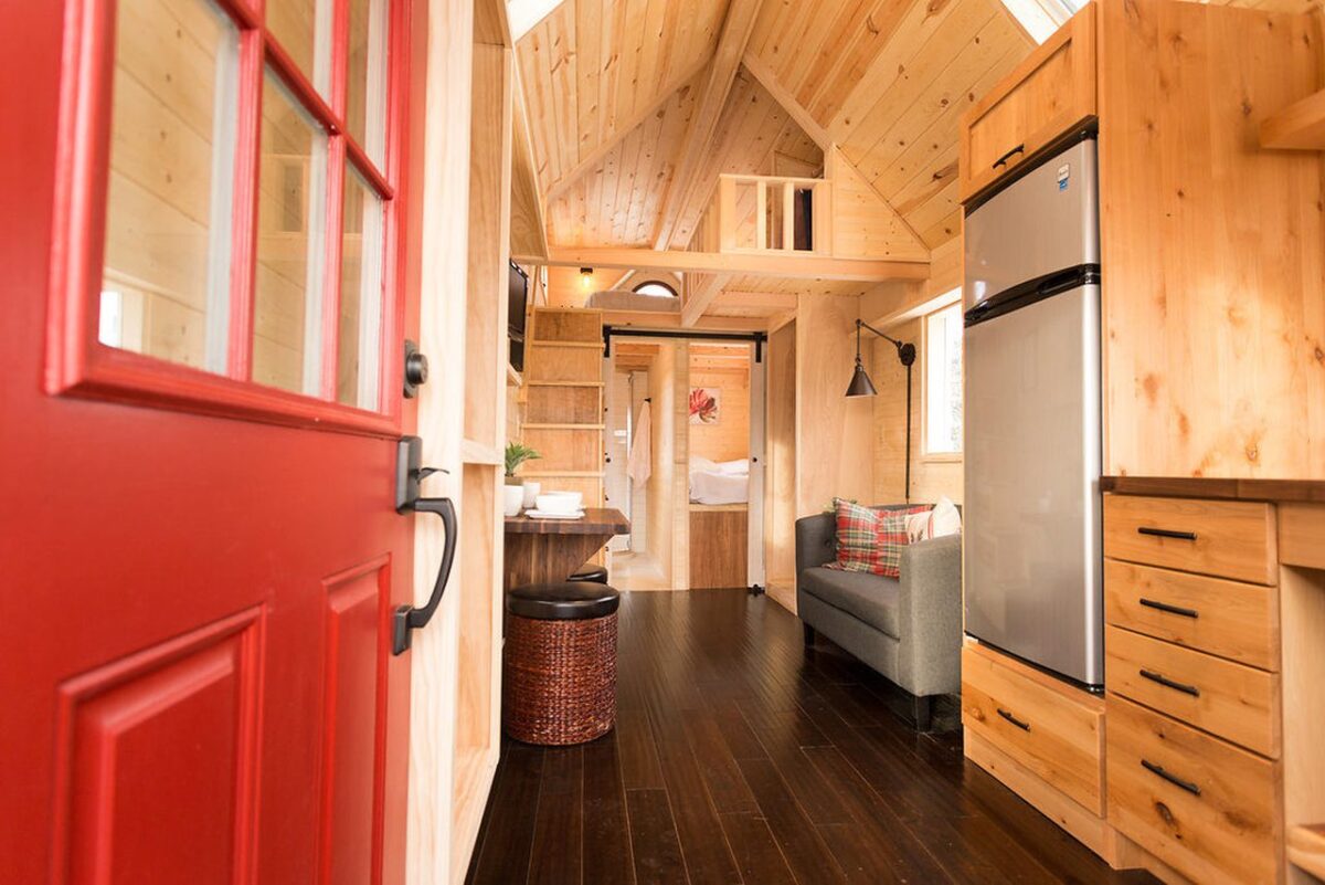 Porchlight Manor Tiny House has Covered Porch, two Bedrooms