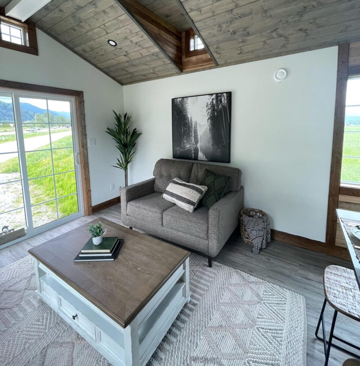 Cottage-Core Elkhorn Tiny House Sleeps Four in Stunning Layout