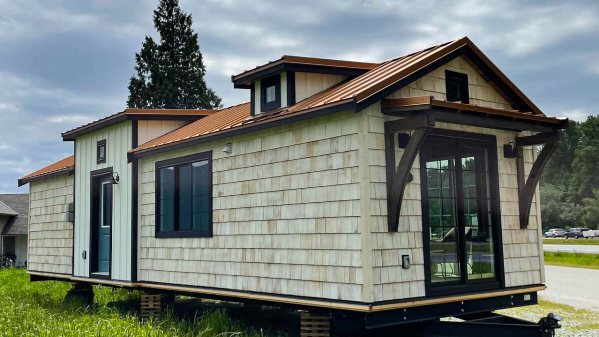 Cottage-Core Elkhorn Tiny House Sleeps Four in Stunning Layout