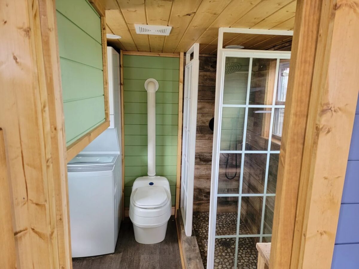 Blue Tiny House Features Two Bedrooms & a Covered Porch