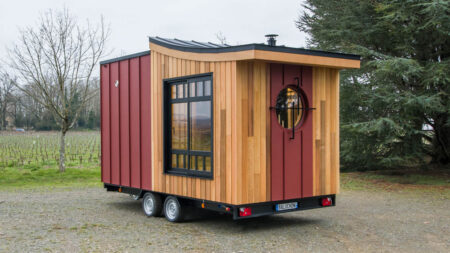 Bonzai Tiny Home Features a Futon, Projector, & Pull-Down Screen