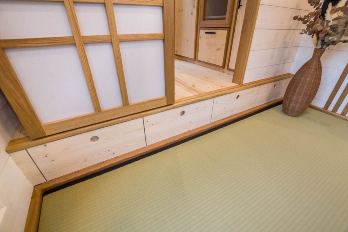 Bonzai Tiny Home Features a Futon, Projector, & Pull-Down Screen