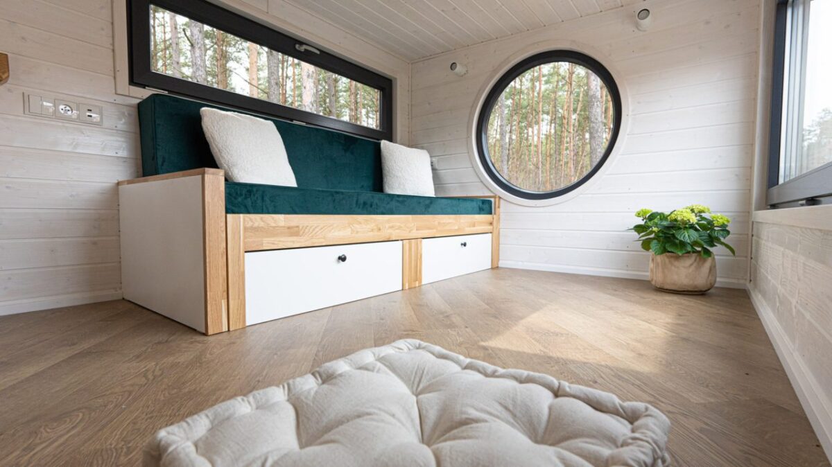 Melon Tiny House has Reverse Loft Layout With Porthole Windows